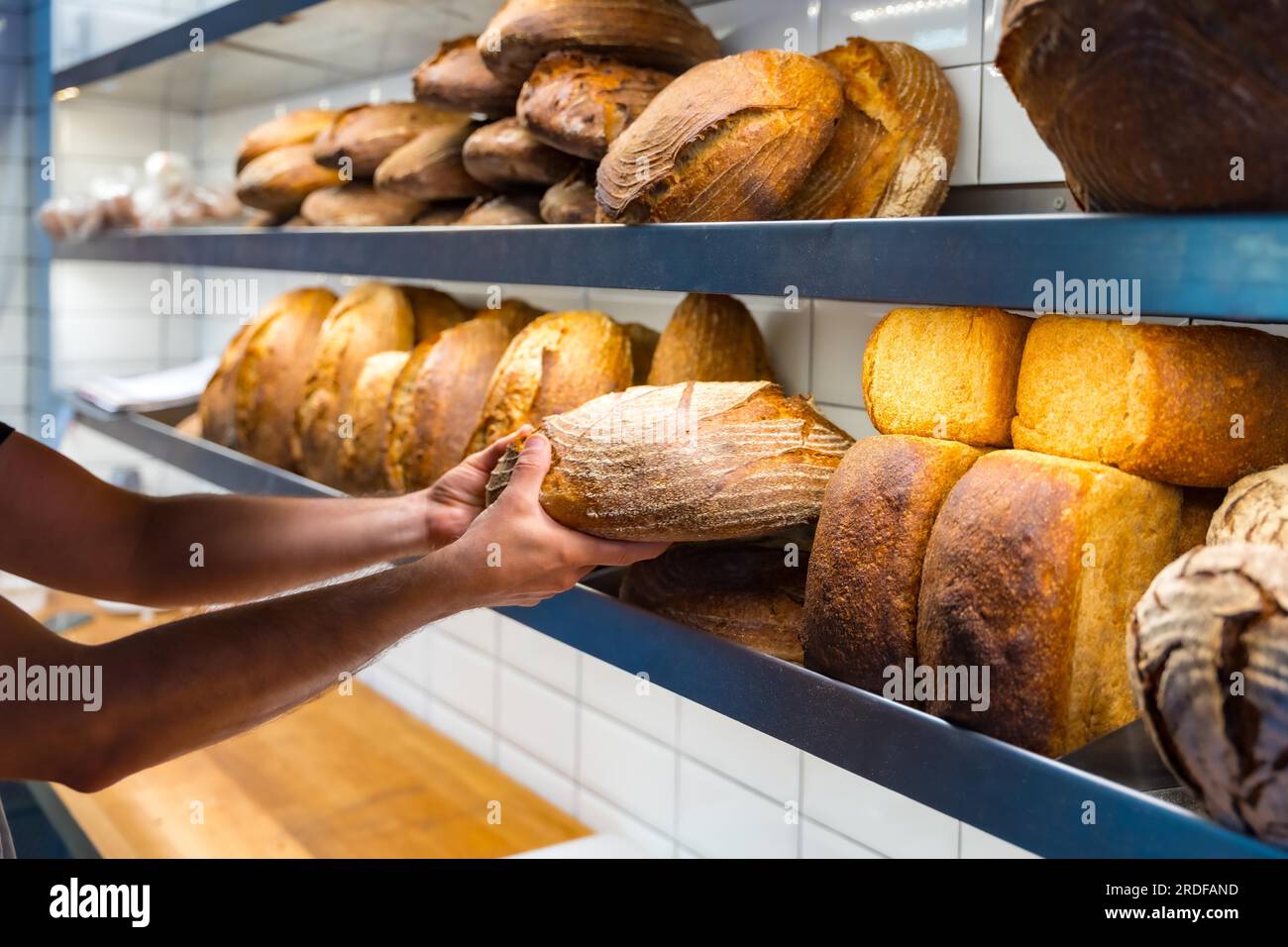 Hands of baker employee of bakery in workshop workshop of artisan ...