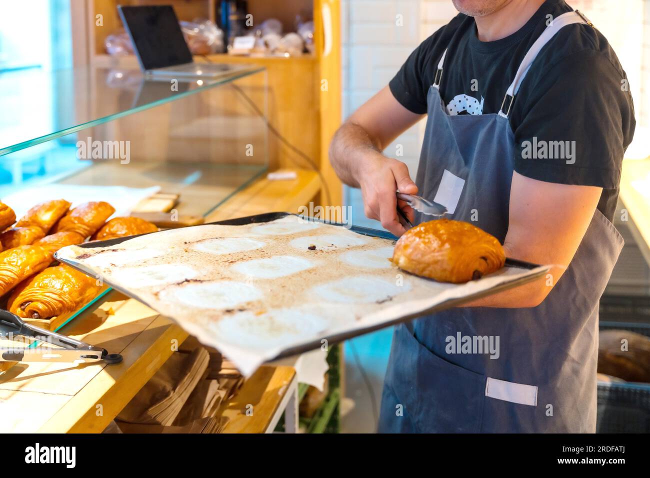 Bakery baker in workshop workshop of artisan bakery and shop placing ...