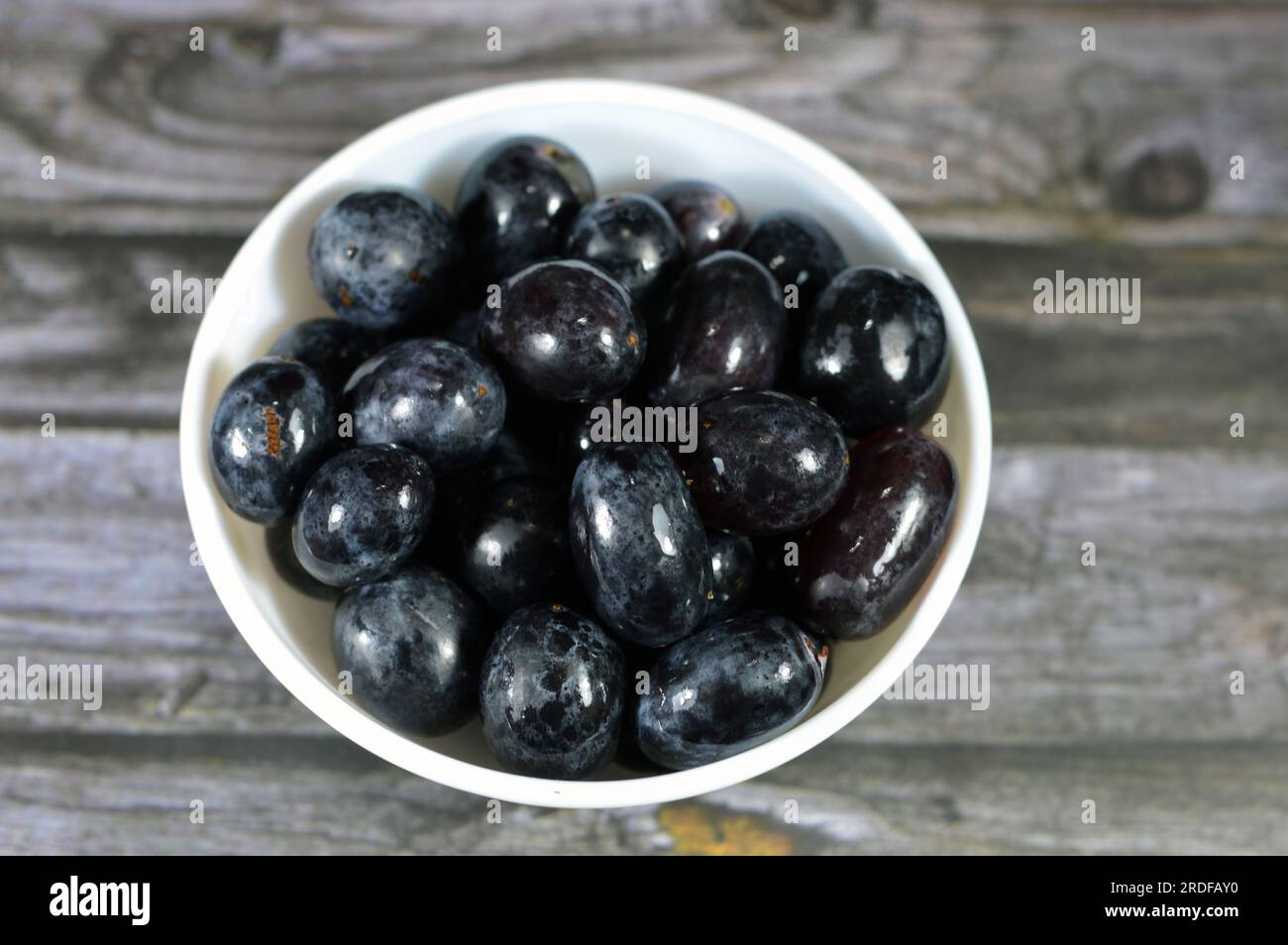 Black grapes, a fruit, botanically a berry of the deciduous woody vines ...