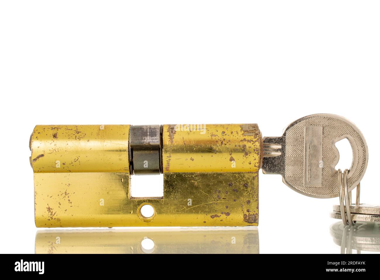 One core metal lock with key, macro, isolated on white background Stock ...