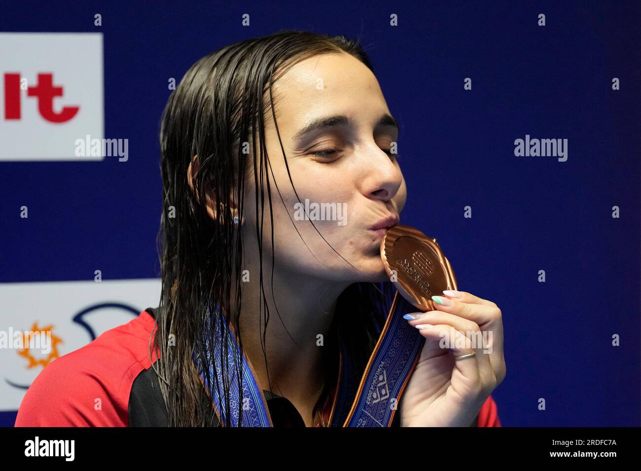 Pamela Ware of Canada kisses her bronze medal after the women's 3m ...