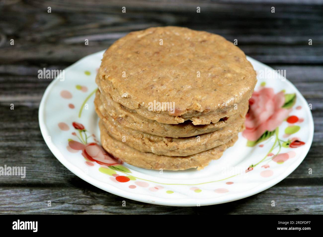 Raw uncooked beef burger ready to be cooked and fried in shallow oil ...