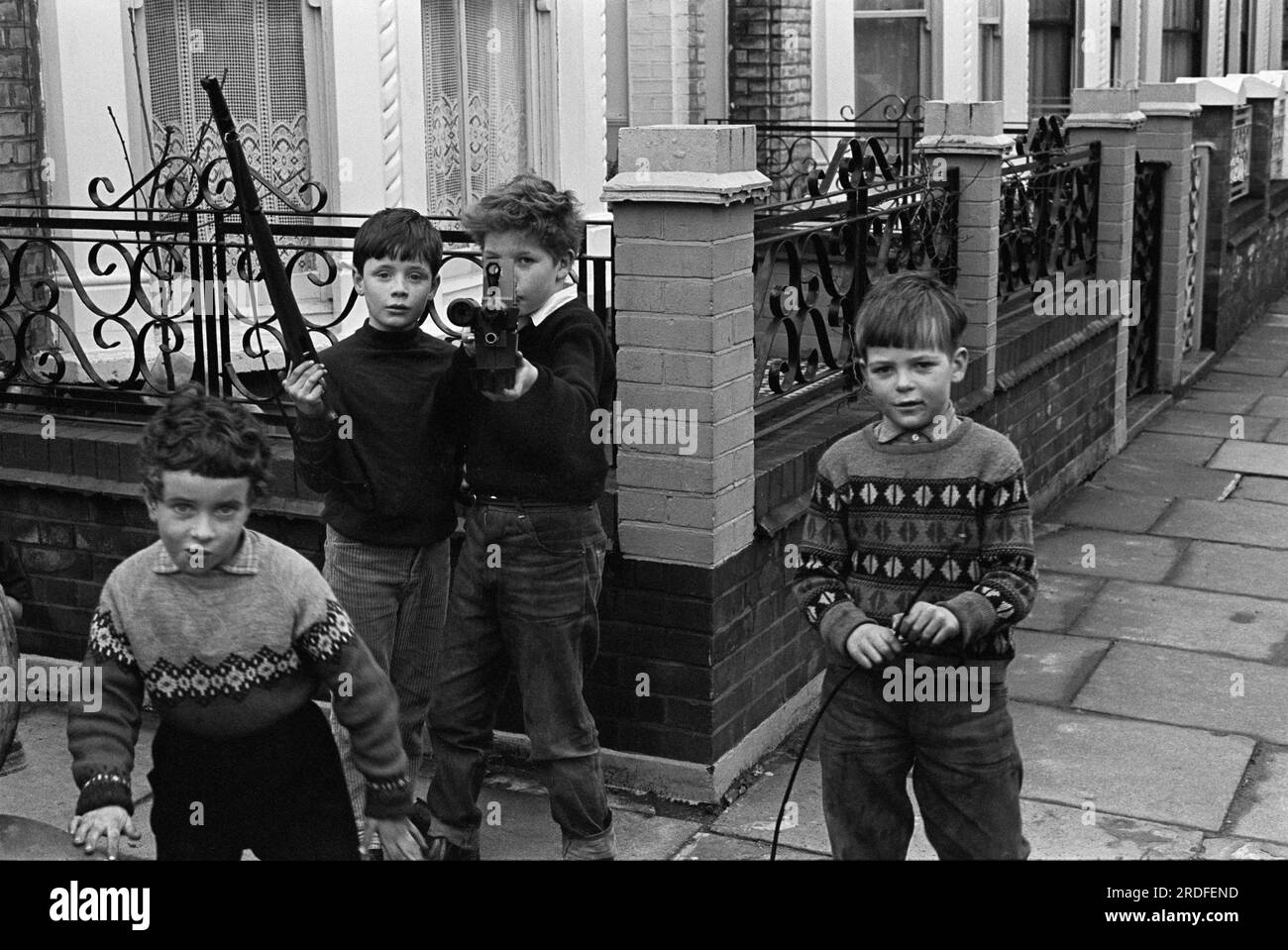 Uk street children playing Black and White Stock Photos & Images - Alamy