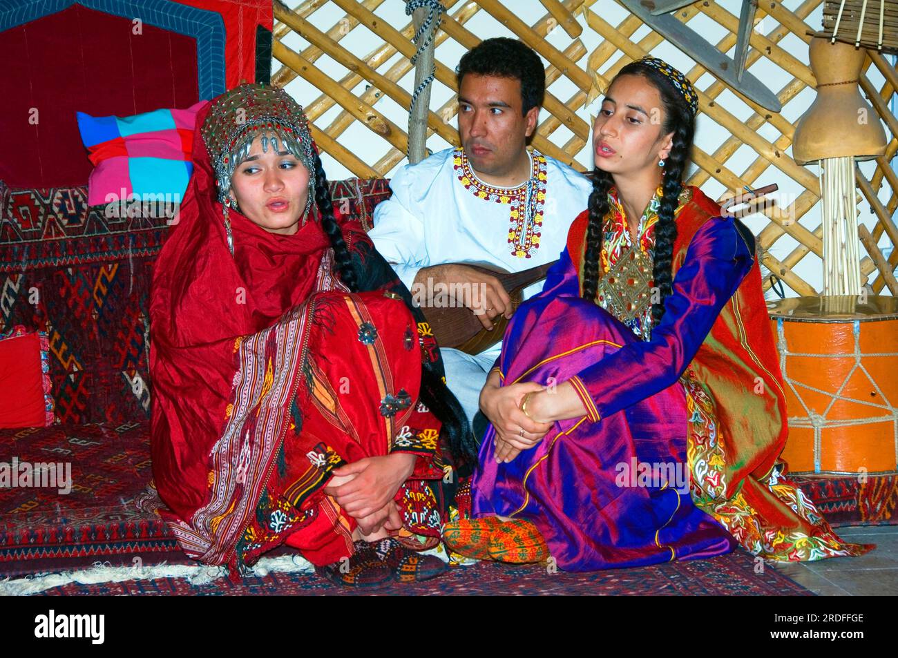 Folklore dance group, man and woman on carpet, Ashgabat, Turkmenistan ...
