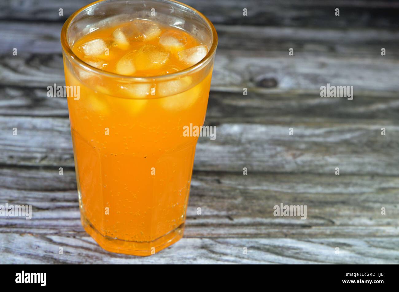 Orange soft drink with ice, orange pop soda, orangeade, carbonated ...