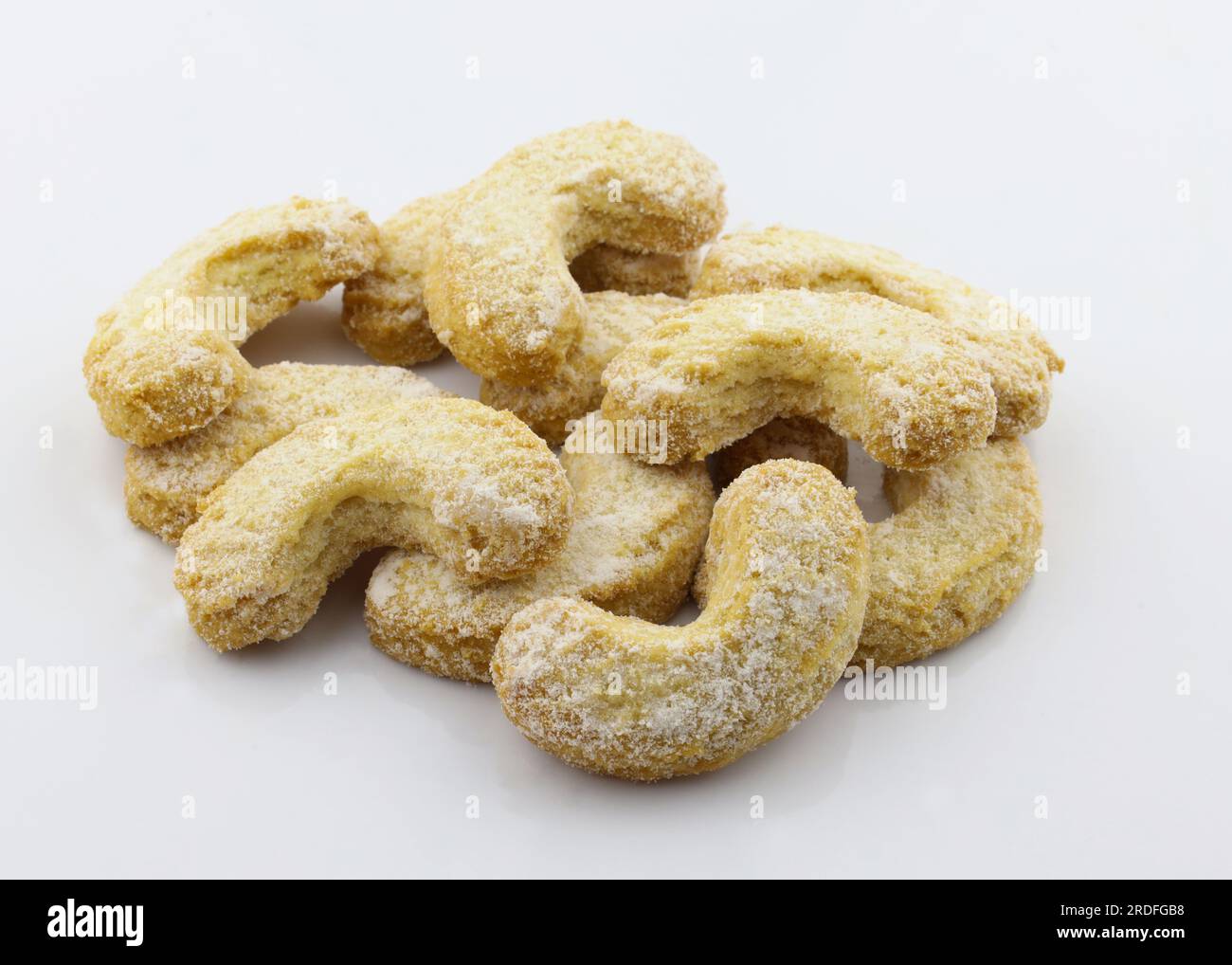 Half-moon shaped shortbread cookies sprinkled with powdered sugar ...