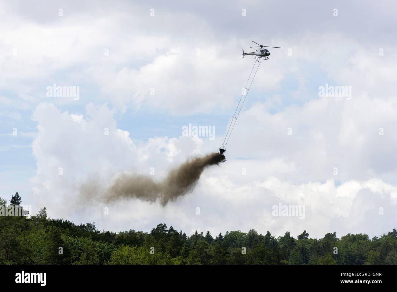 Symbolic image, climate change, helicopter, helicopter spreading finely ...