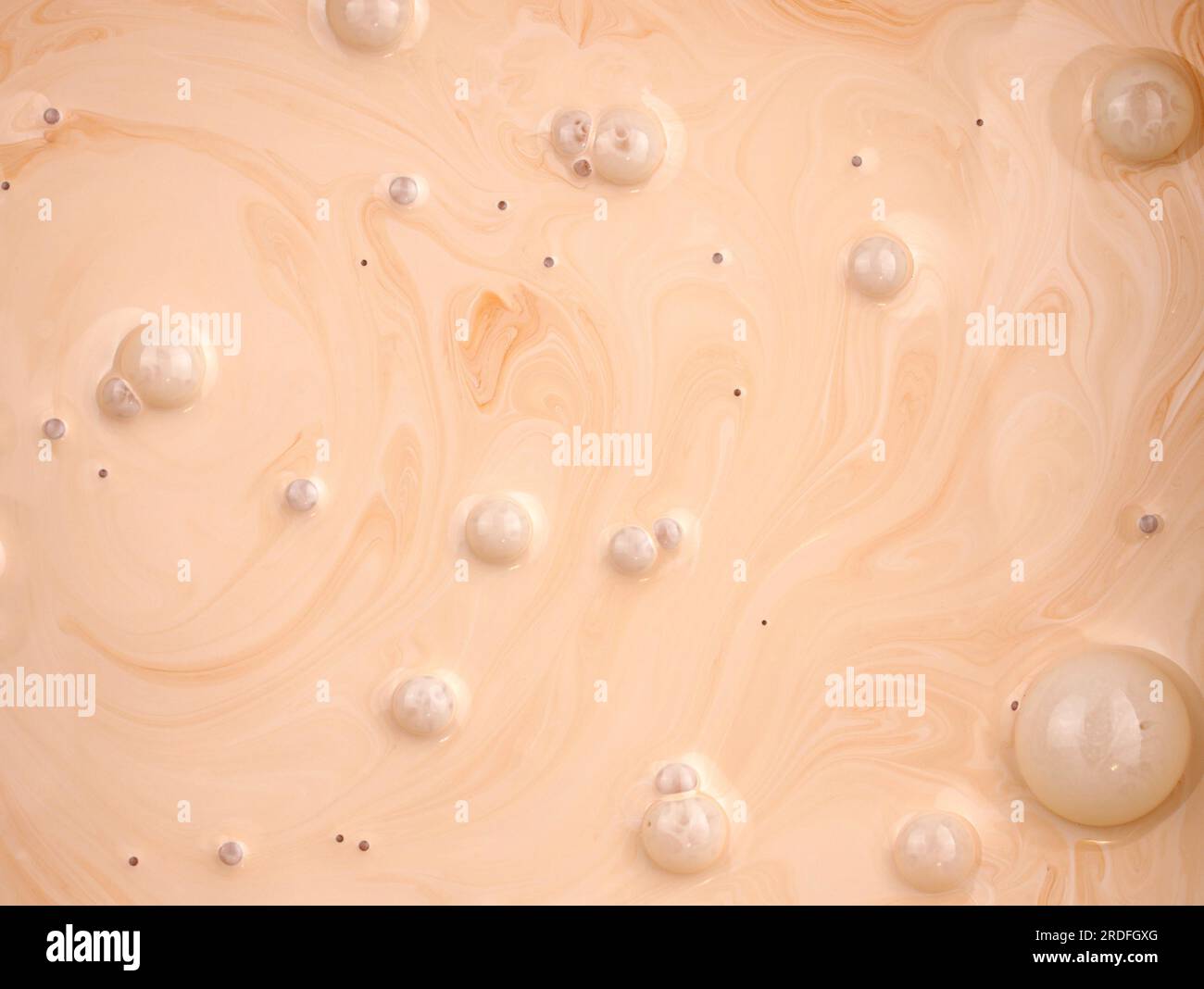 Emulsion liquid paint with bubbles top view. Cream wall paint close-up ...