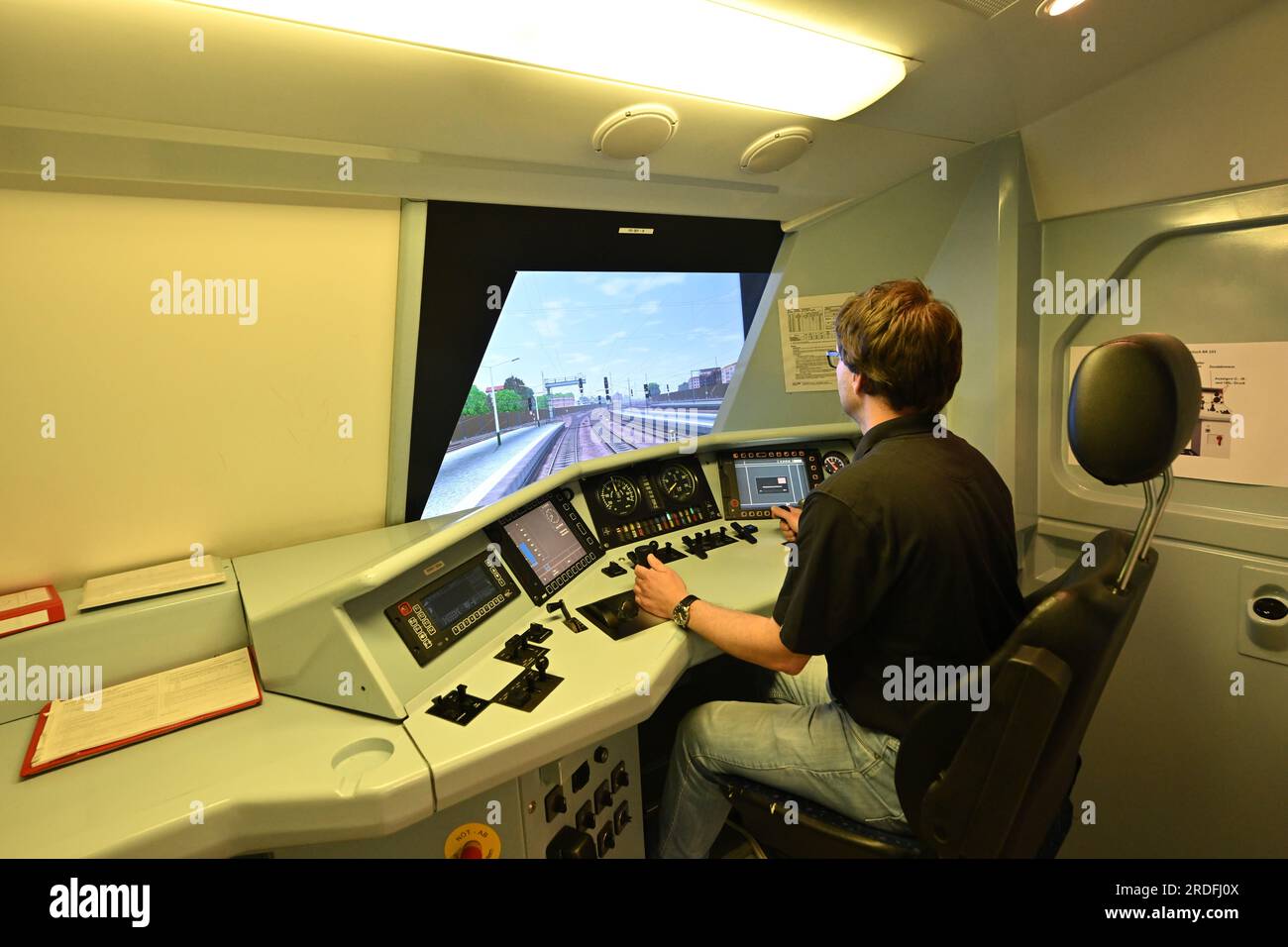 Munich, Germany. 21st July, 2023. A trainer teaches in a train driver's ...