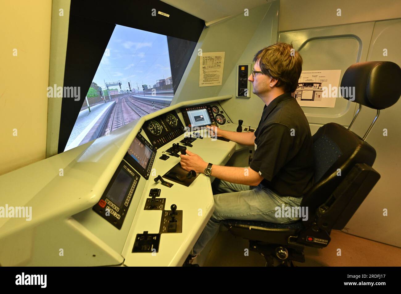 Munich, Germany. 21st July, 2023. A trainer teaches in a train driver's ...