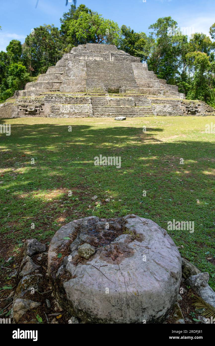 Stone stela in front of the Jaguar Temple in the ruins of a Mayan city ...