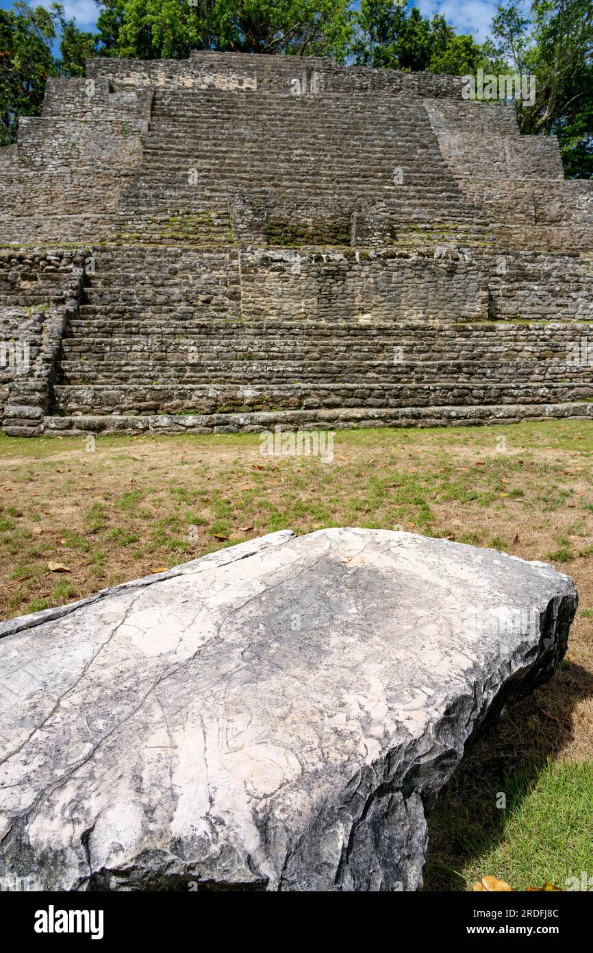 Stone stela in front of the Jaguar Temple in the ruins of a Mayan city ...