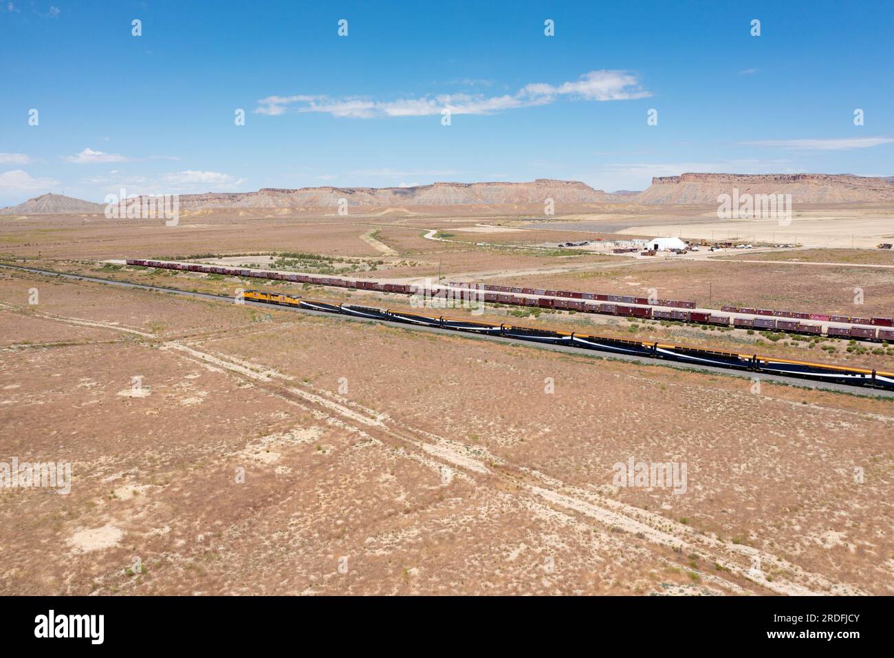 A passenger train passes the UMTRA permanent deposition site for ...