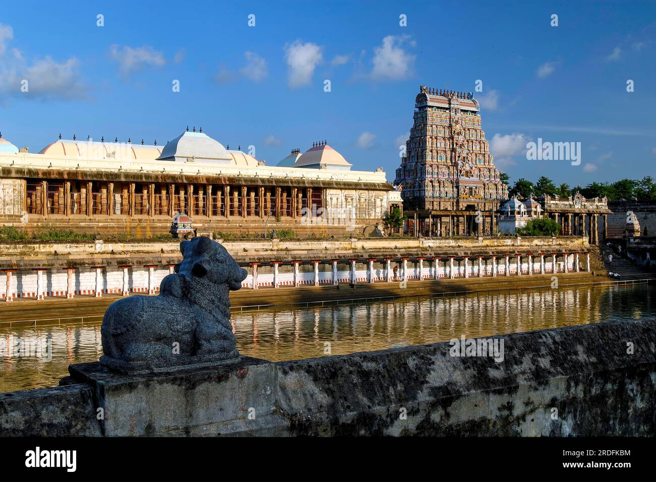 The Sivaganga tank surrounded by colonnades with east gopuram tower in ...