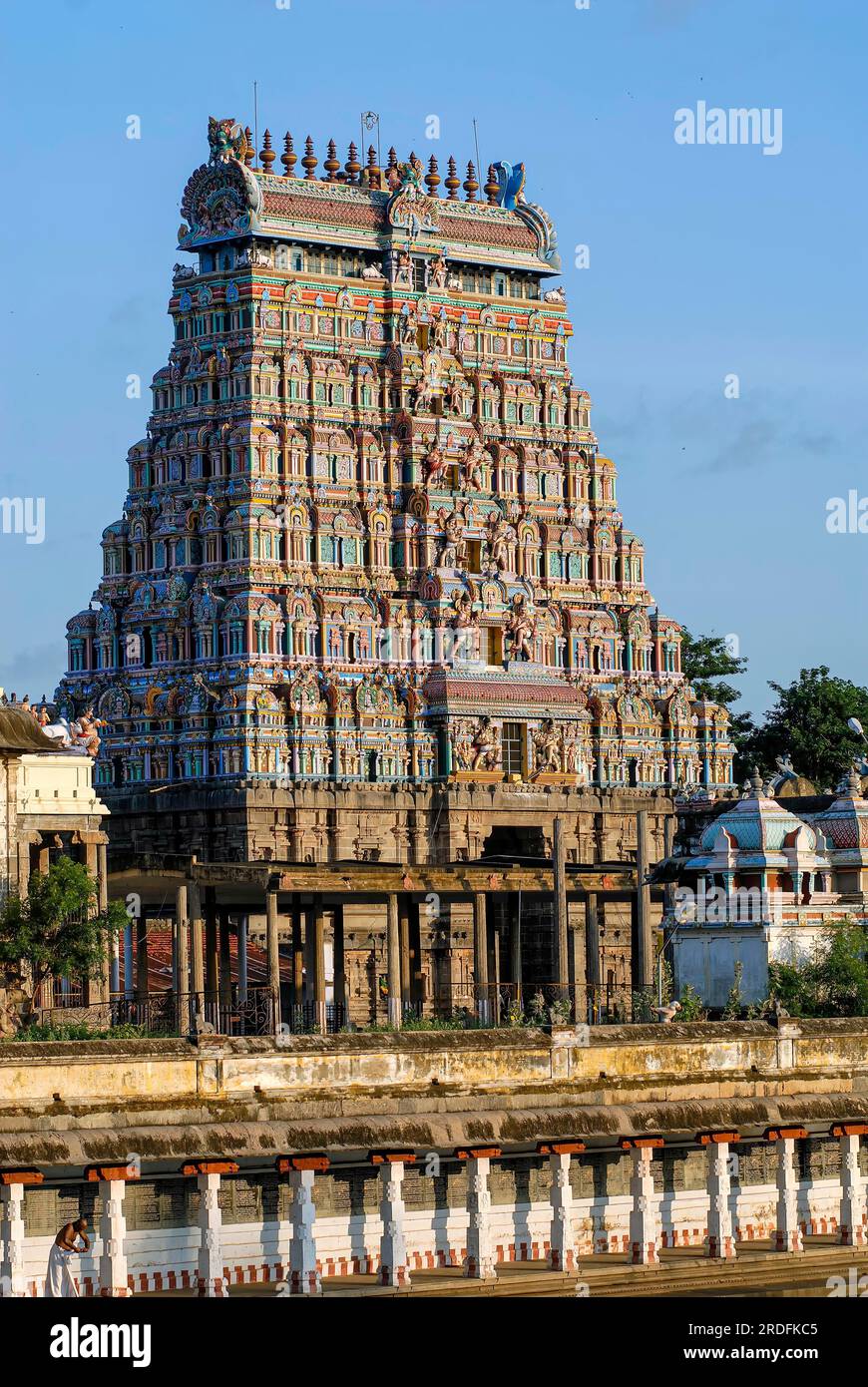 The Sivaganga tank surrounded by colonnades with east gopuram tower in ...