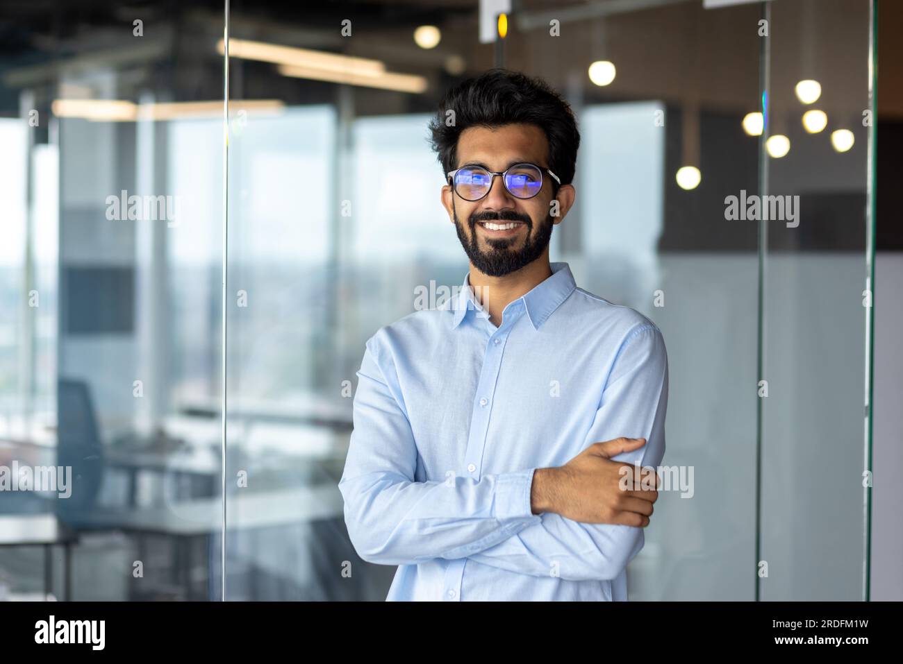 Portrait of a young Indian male designer, engineer, architect who is ...