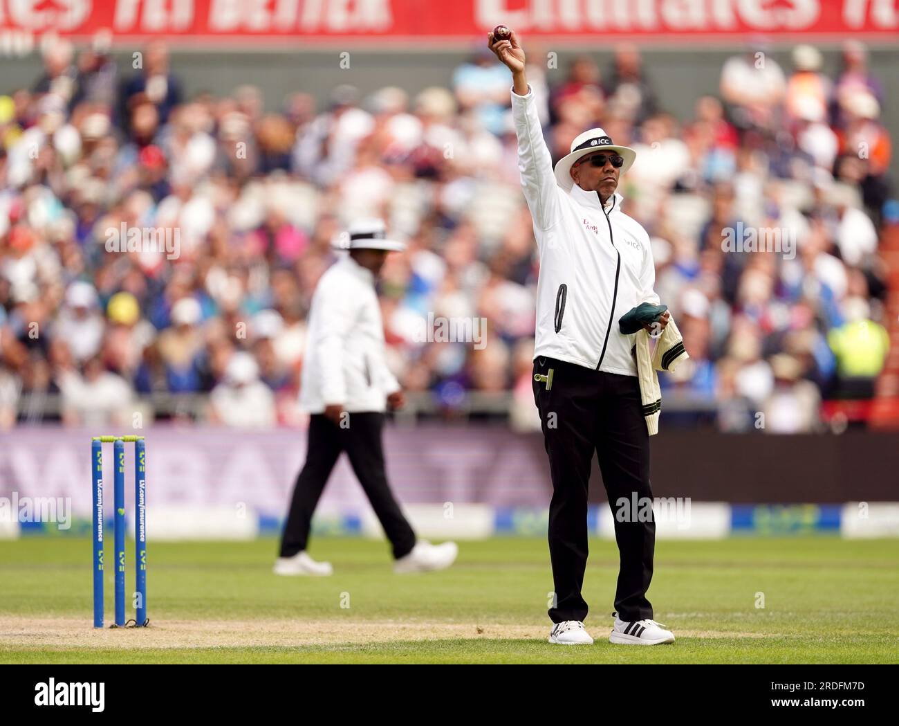 Umpire Joel Wilson signals that a new ball has been taken on day three ...