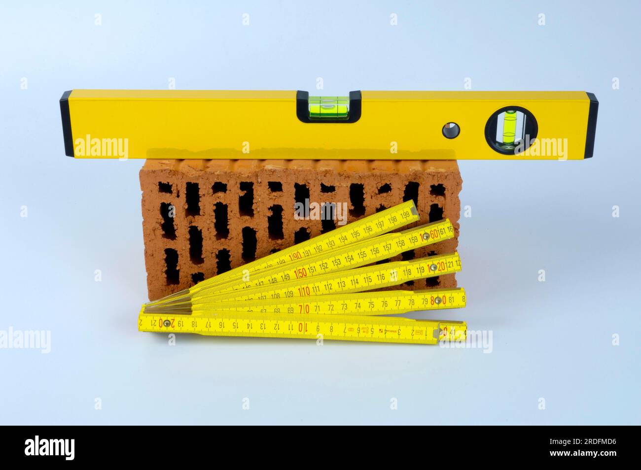 Brick, spirit level and scale, folding rule, folding ruler, cutout ...