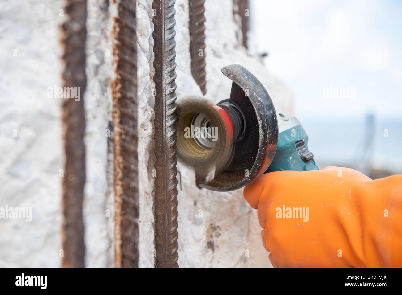 Crop worker polishing iron rod with grinder Stock Photo - Alamy
