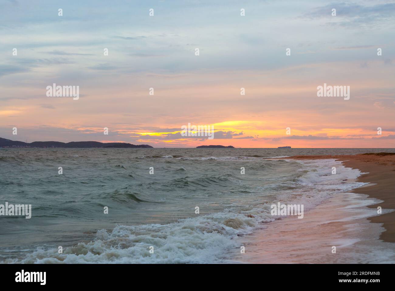 Raging Sea with Sunset Sky Background Stock Photo - Alamy