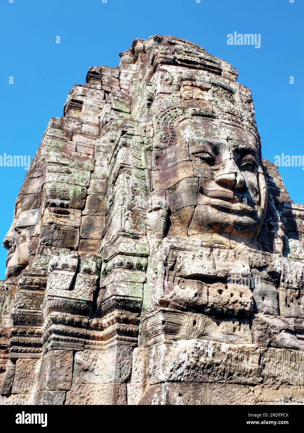 Smiling stone face, a unique aspect of ancient Cambodian sculpture ...
