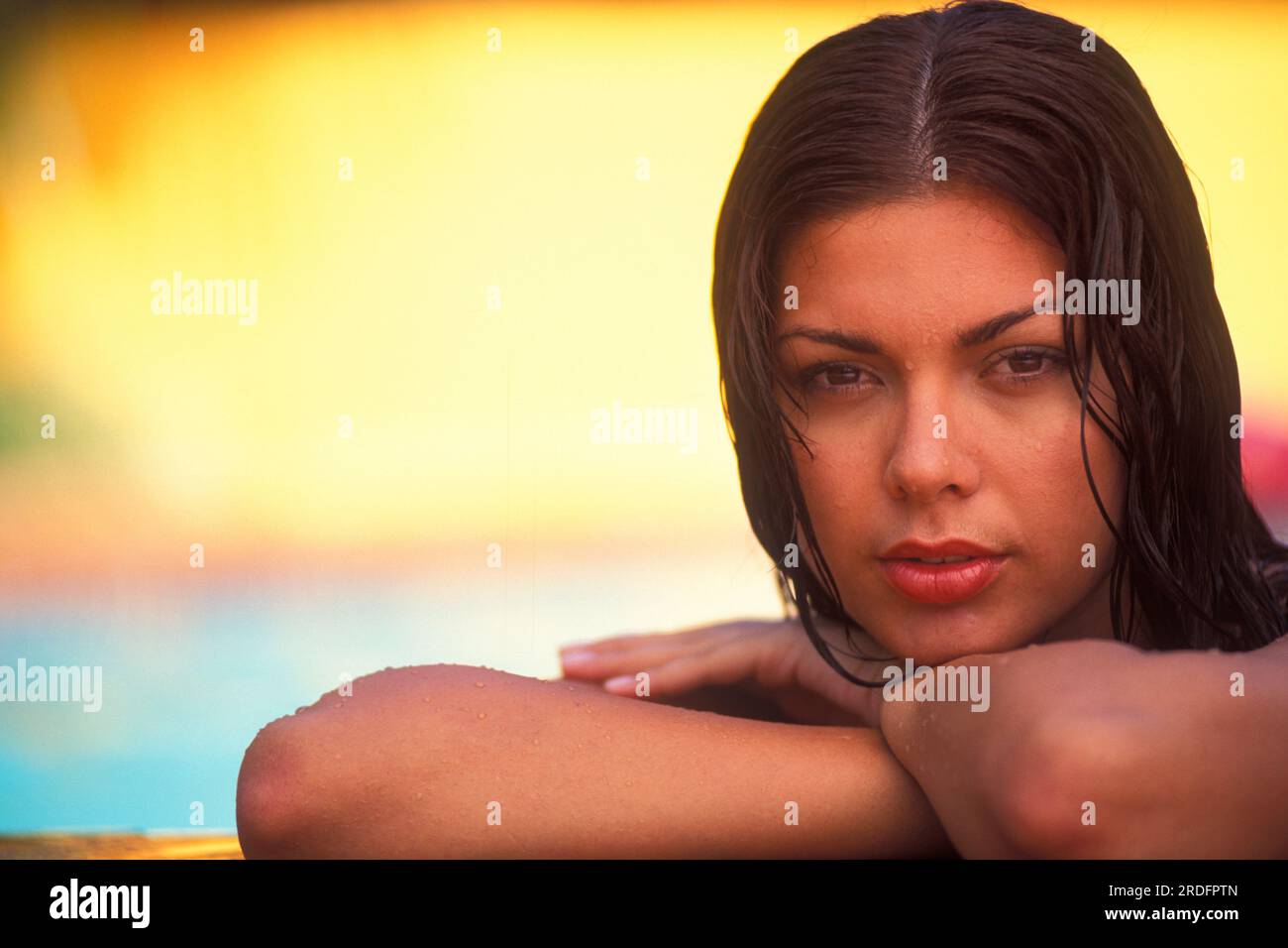 Portrait of an hispanic woman by the pools edge Stock Photo - Alamy