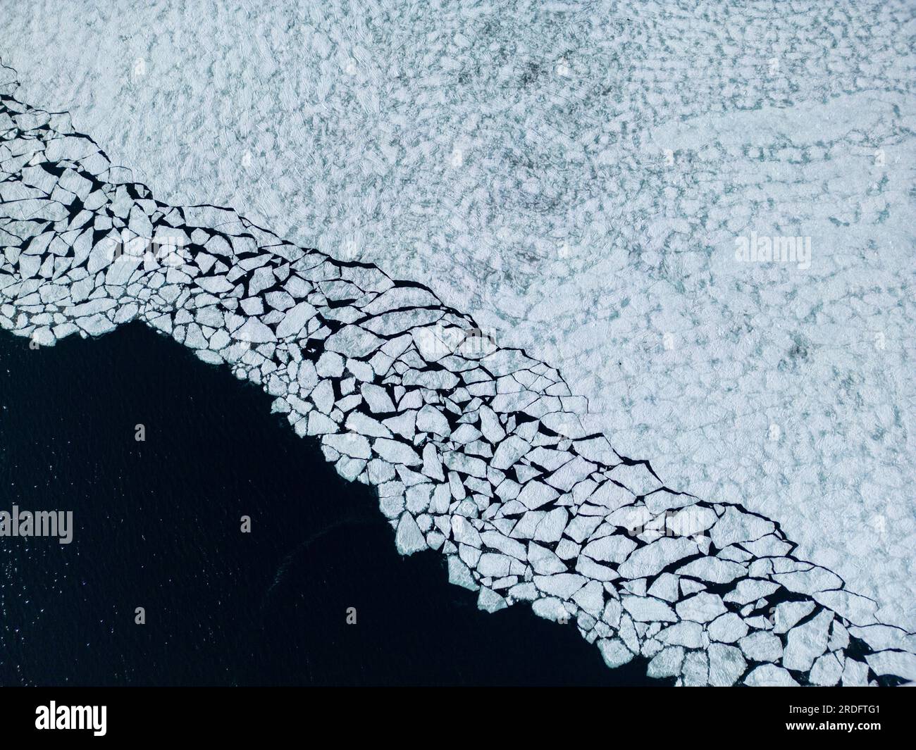A view from above on the ice rig covering the arctic breaking into ...