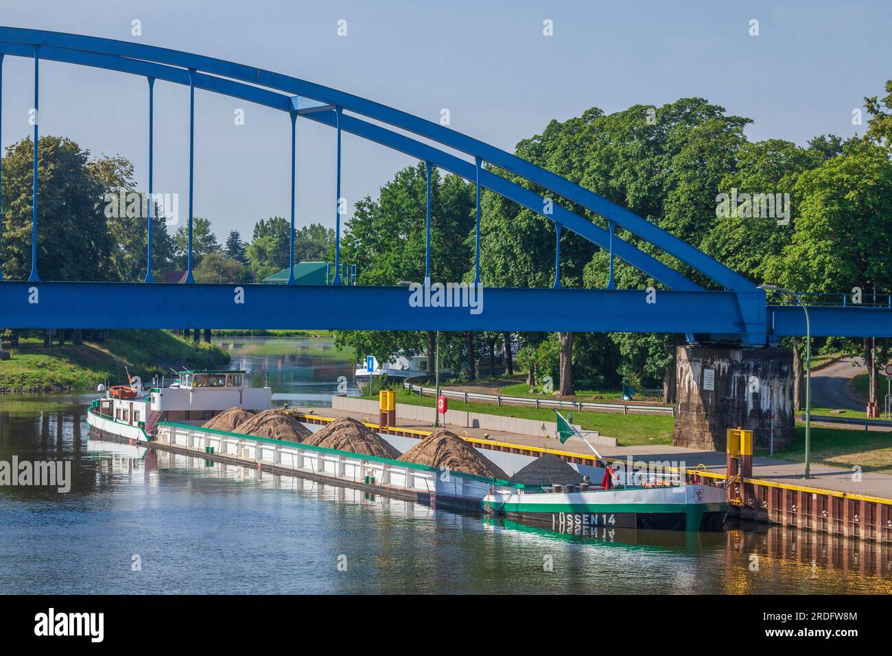 Barge loaded with bulk cargo lying in harbour on the river Weser with ...
