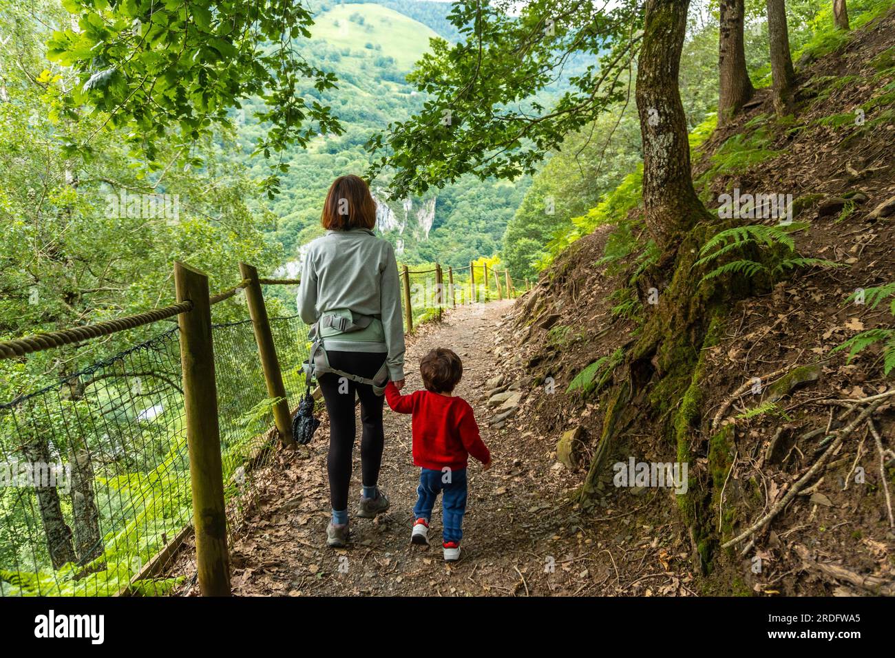 Mother and son on a trail in the Borce commune of the French Pyrenees ...