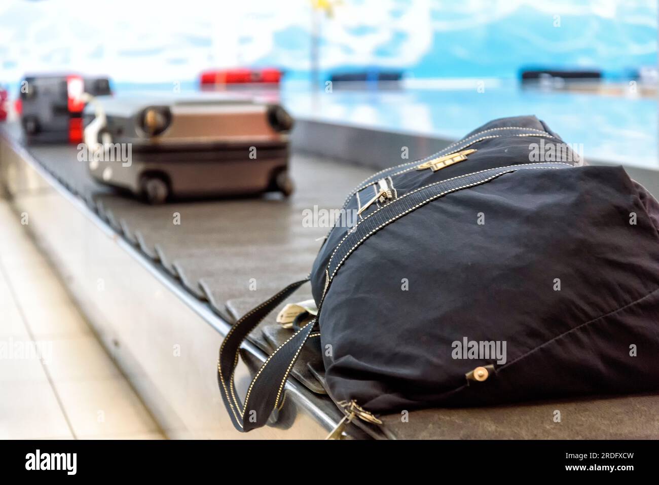 baggage on a baggage carousel an an airport Stock Photo - Alamy