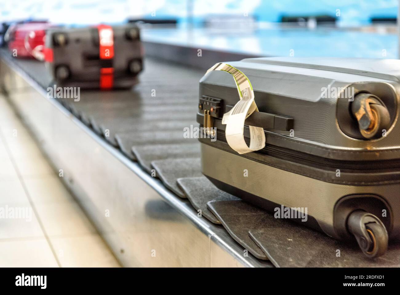 baggage on a baggage carousel an an airport Stock Photo - Alamy