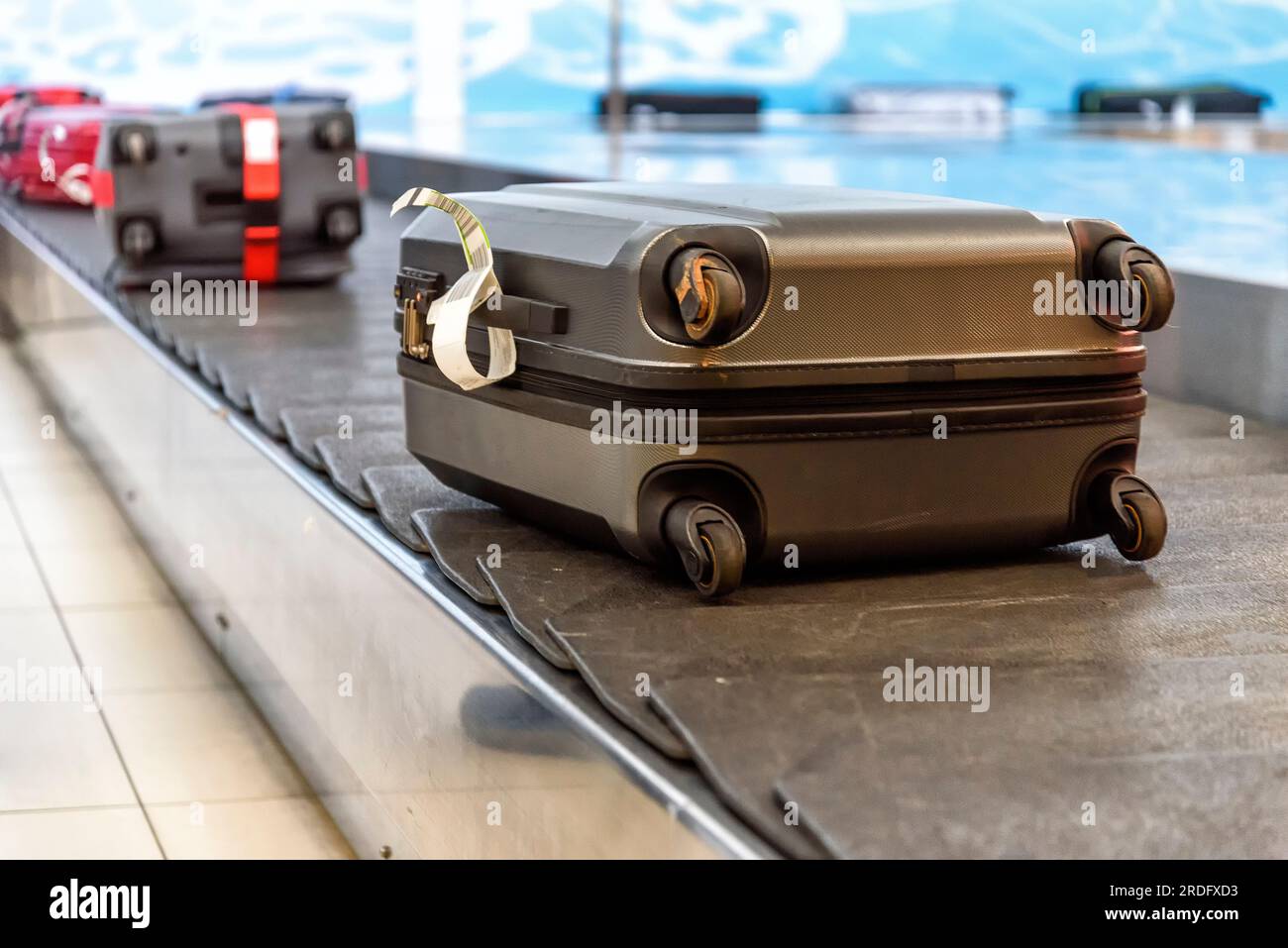 baggage on a baggage carousel an an airport Stock Photo - Alamy