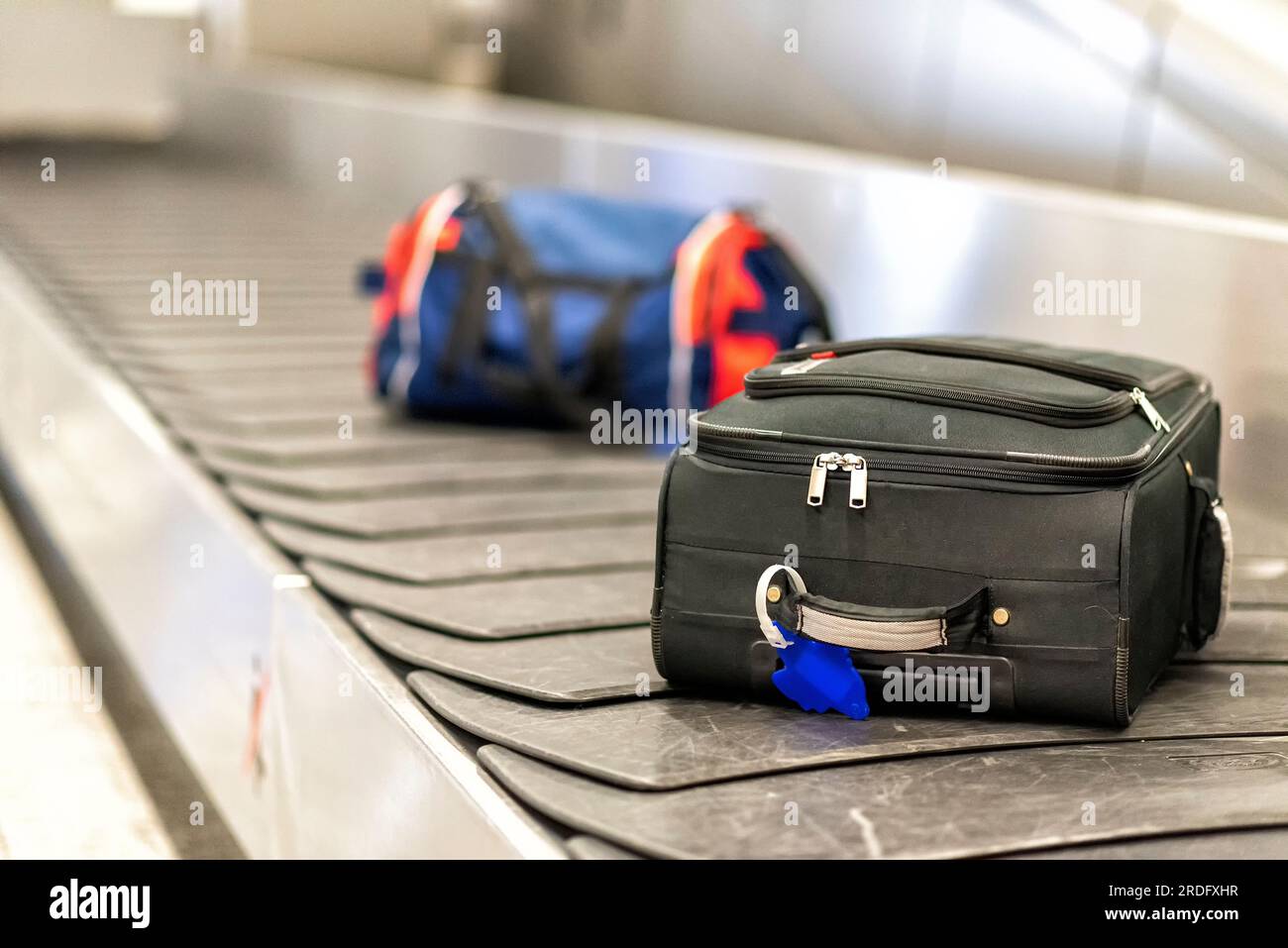 baggage on a baggage carousel an an airport Stock Photo - Alamy