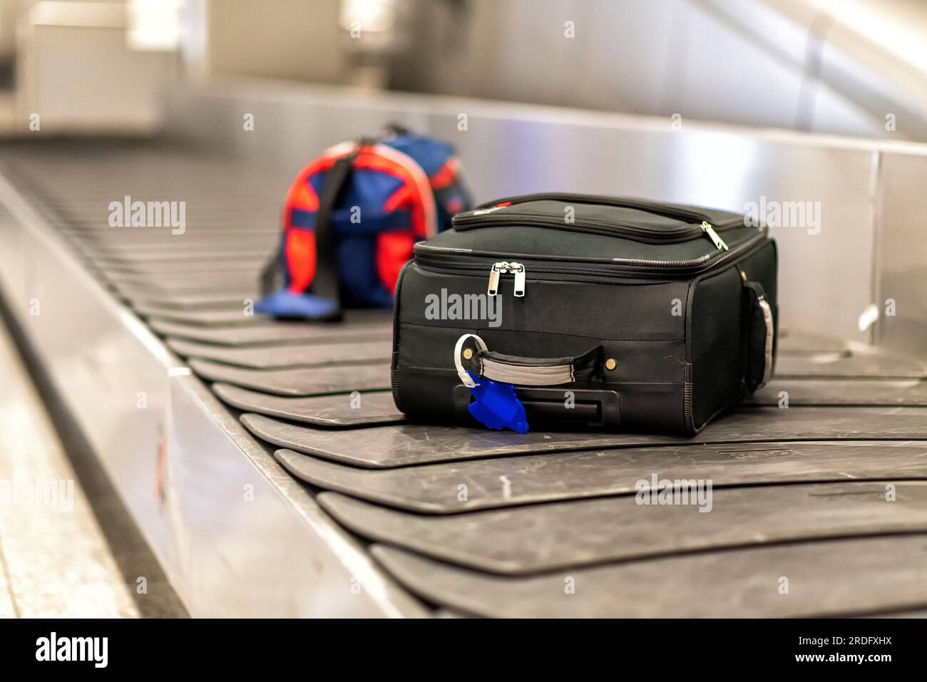 baggage on a baggage carousel an an airport Stock Photo - Alamy