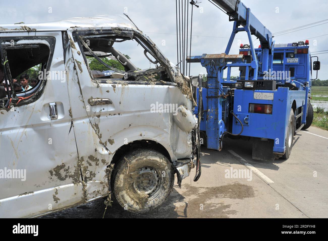 Sylhet, Bangladesh. 20th July 2023. A crane lifting the wrecked CNG and ...