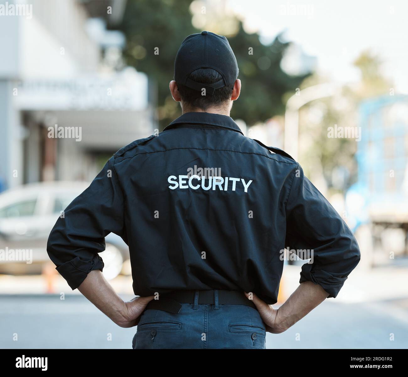 Man, back and security guard in city for safety protection, law ...