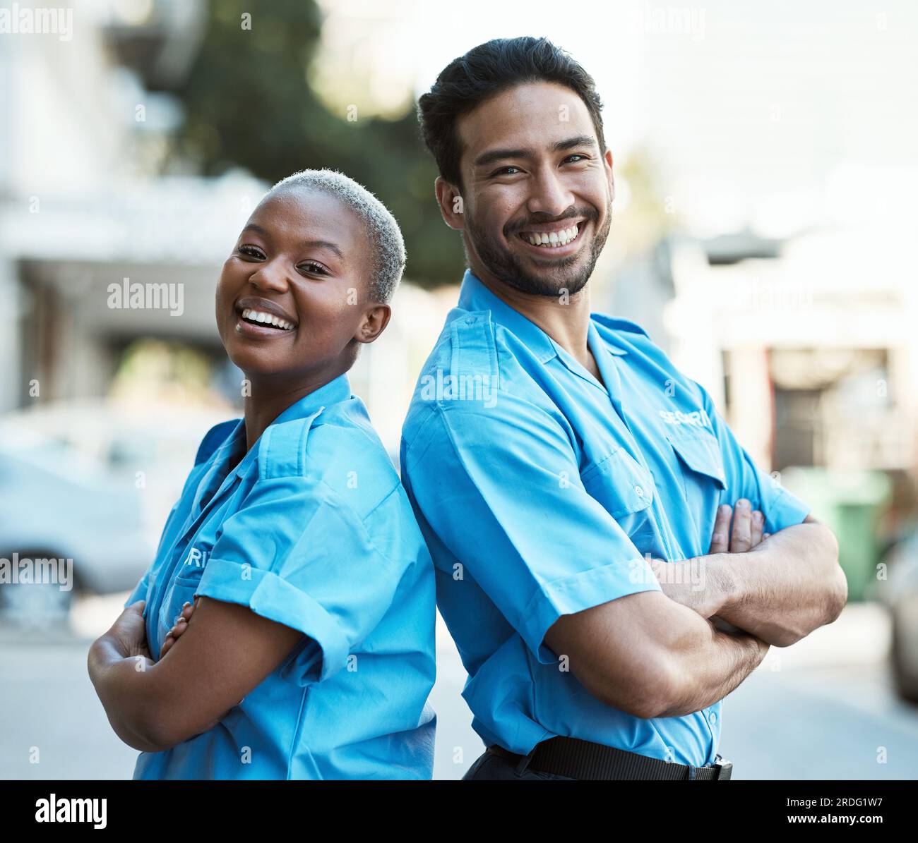 People, portrait and security guard smile with arms crossed in city for ...