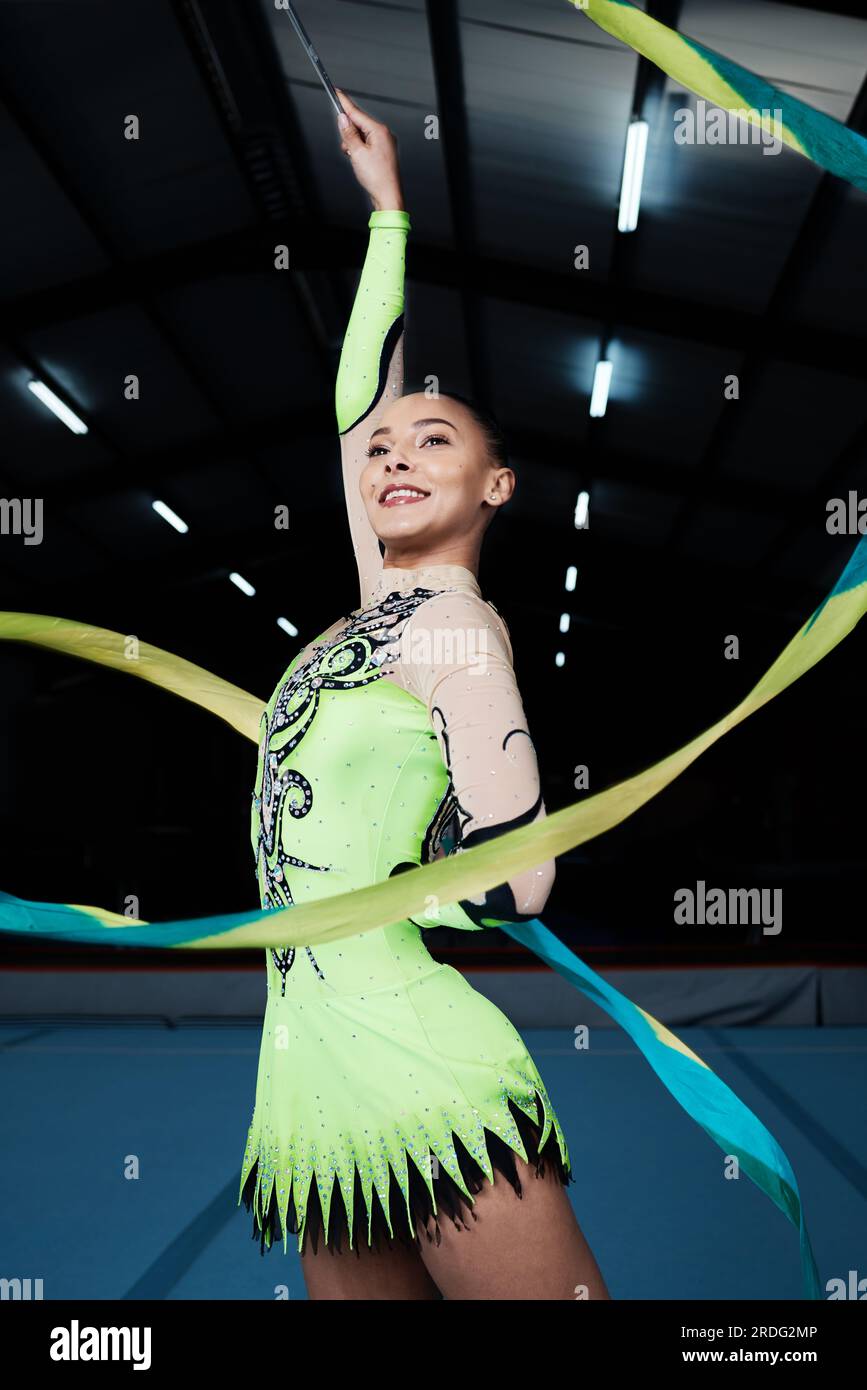 Happy, woman and rhythmic gymnastics with ribbon in gym, creativity and ...