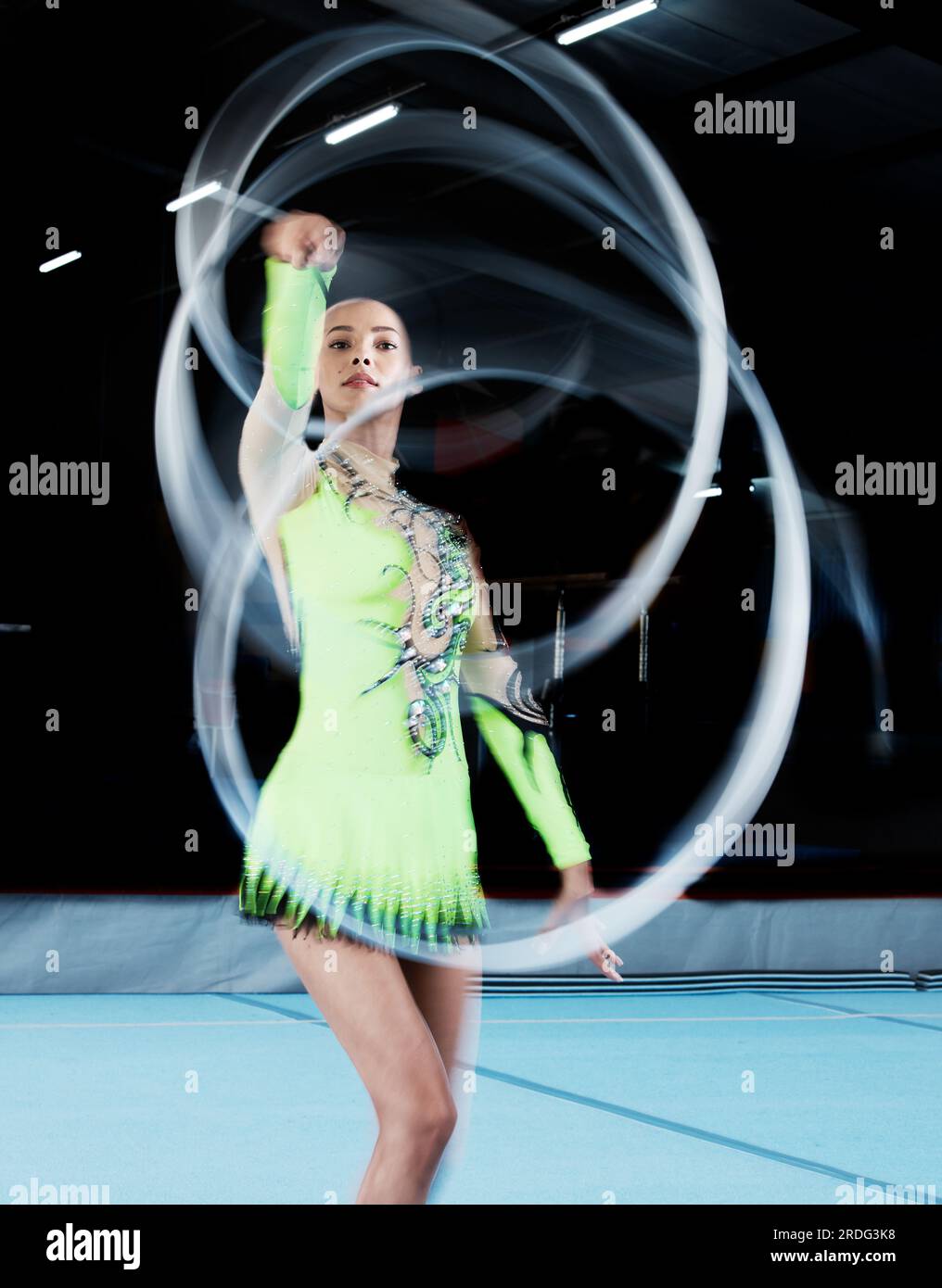 Gymnastics, sports and woman with ribbon blur in gym for rhythmic body ...