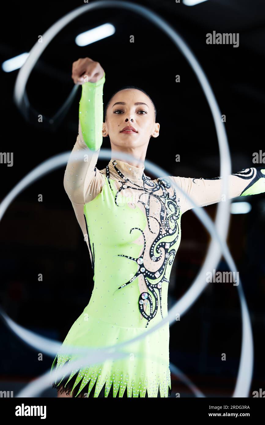 Gymnastics, dance performance and woman with ribbon for rhythmic ...