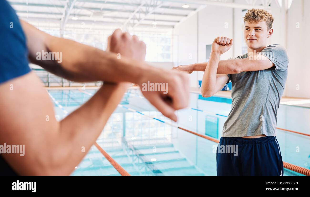 Man, swimmer and stretching with personal trainer for exercise ...