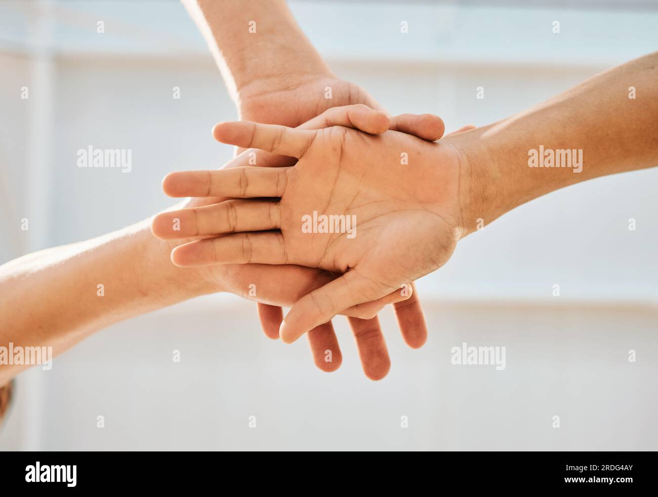 Hands stacked, support and group of people for teamwork, collaboration ...