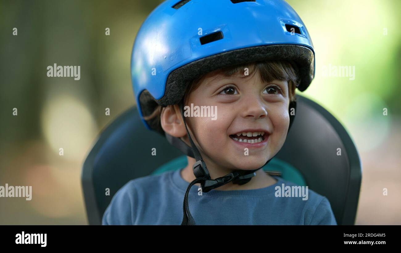 Happy little boy wearing bicycle helmet laughing and smiling Stock ...