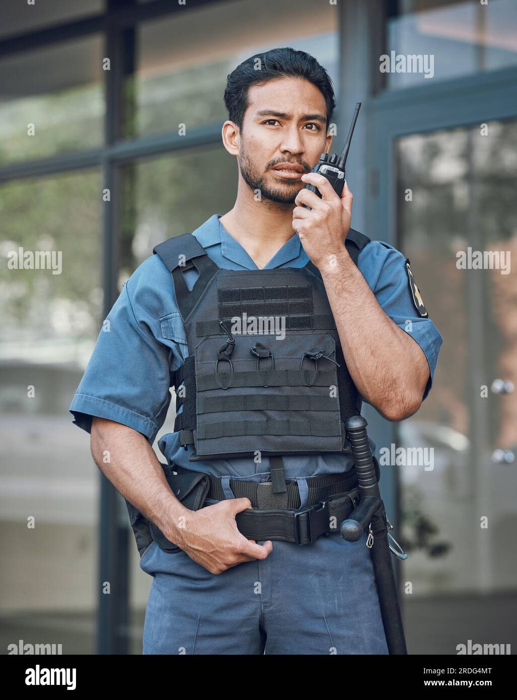 Man, radio and a security guard or bodyguard outdoor on in a city with ...