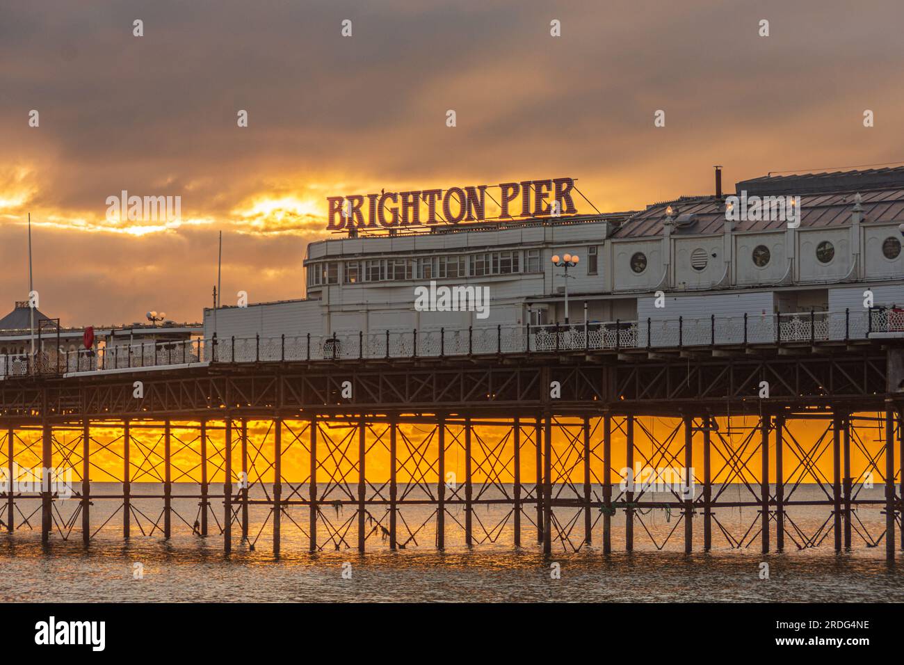 Brighton, UK - December 1st 2022: Golden sky from the sun setting ...
