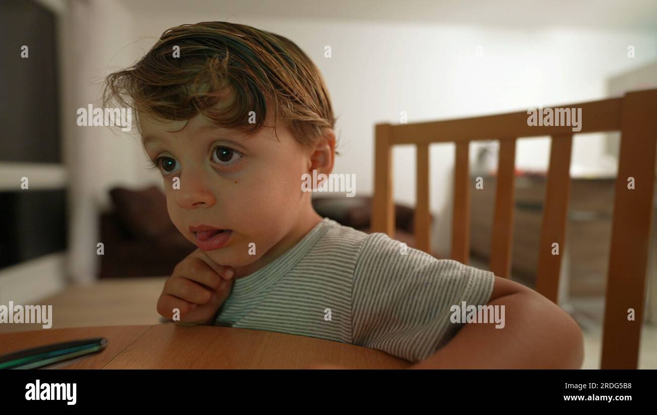 Little boy hypnotized by screen kid watching movie at home Stock Photo ...