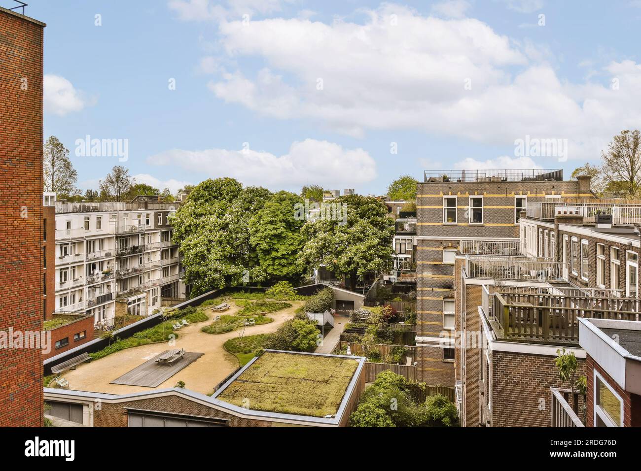 a green roof on an apartment building in london, england with blue sky ...