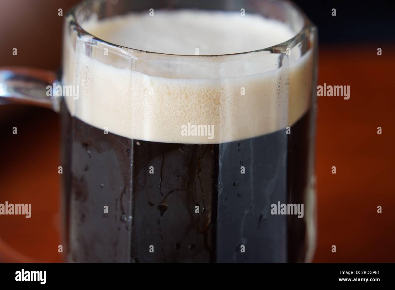 Dark beer in a beer mug. Czech beer on table of bar pub restaurant in ...