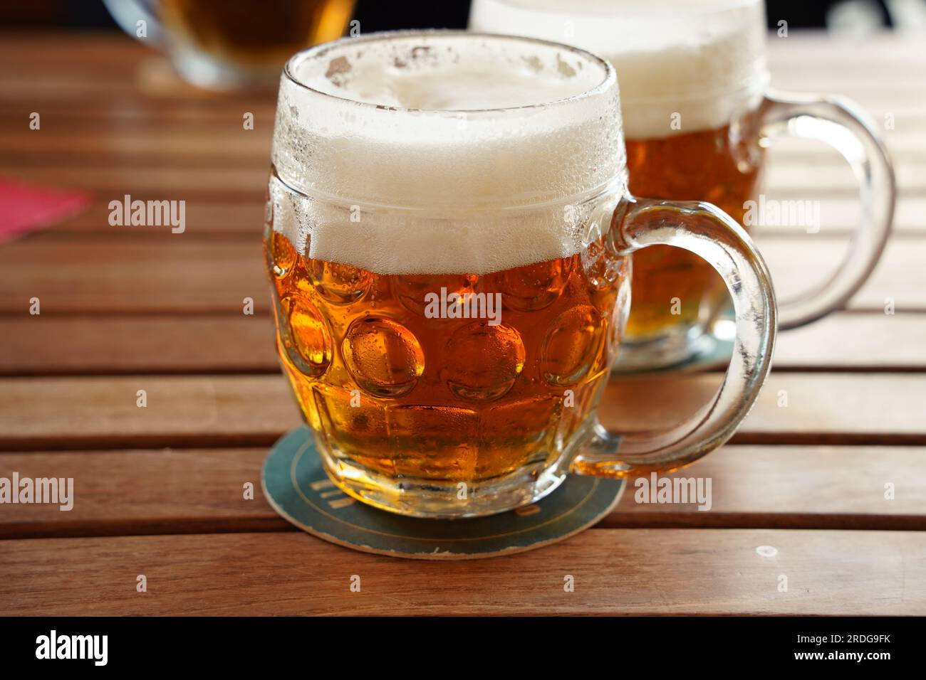 Czech-style Pilsner lager golden beer on table of bar pub restaurant in ...