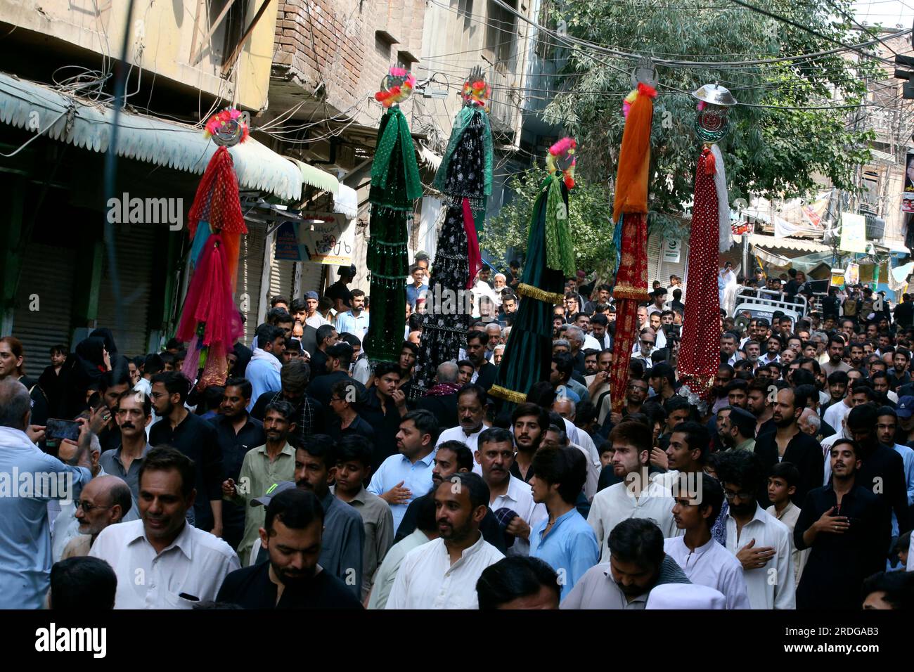 People participate in the Ashoura procession in Peshawar, Pakistan ...
